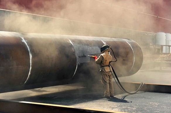 How Sandblasting Enhances Industrial Cleaning Processes